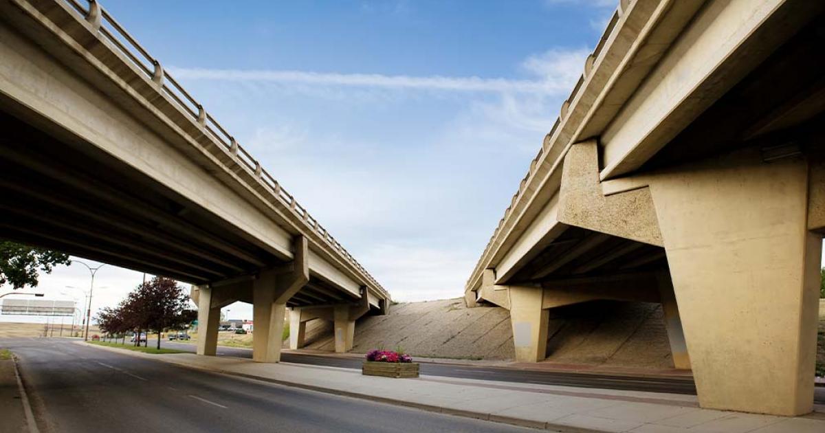 Oversized Load Hits Overpass So Hard an Excavator Was Knocked off the ...