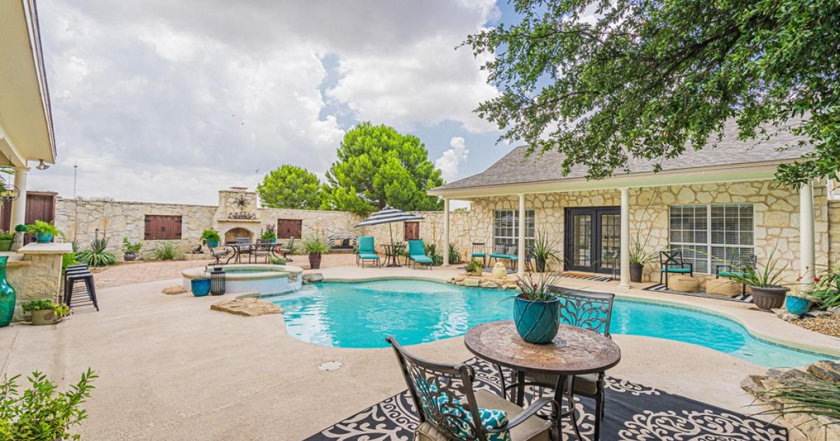 Real Estate Guide: An In-Ground Pool Accents this Gorgeous 5/4 in Wall