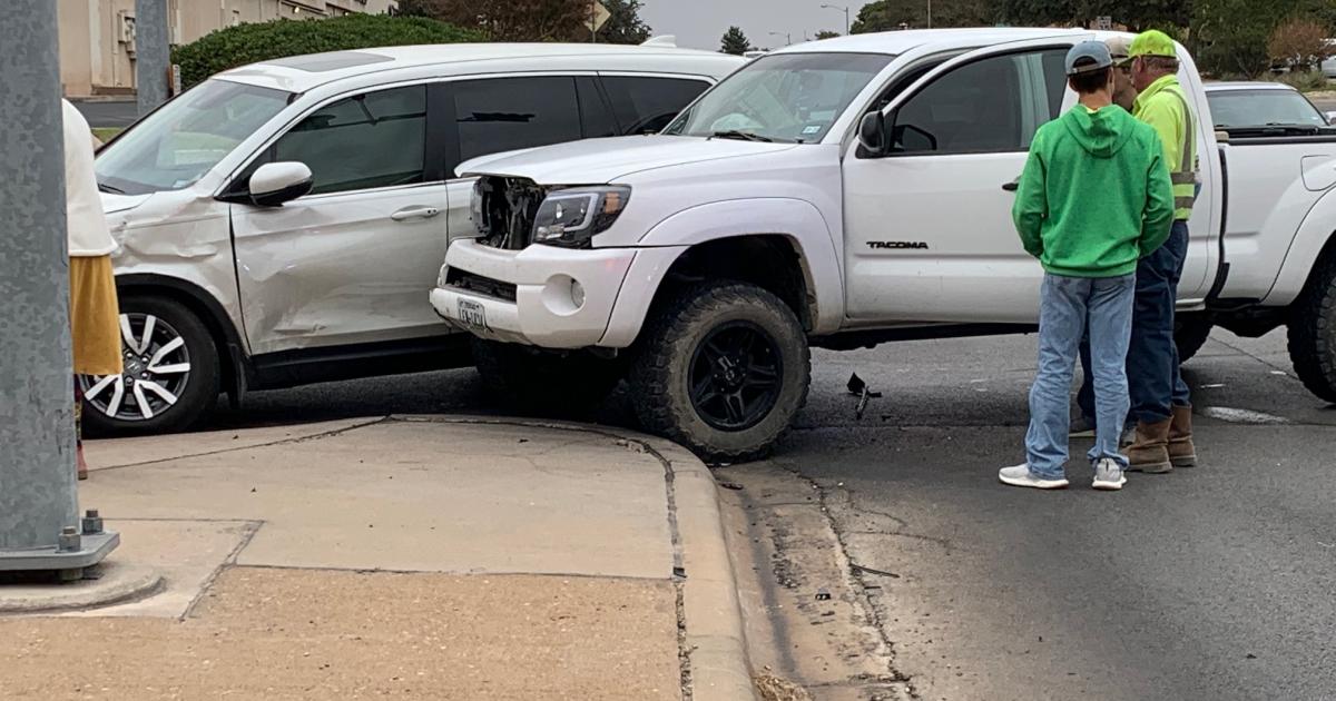 Driver Causes Crash In Busy Intersection After Running Red Light