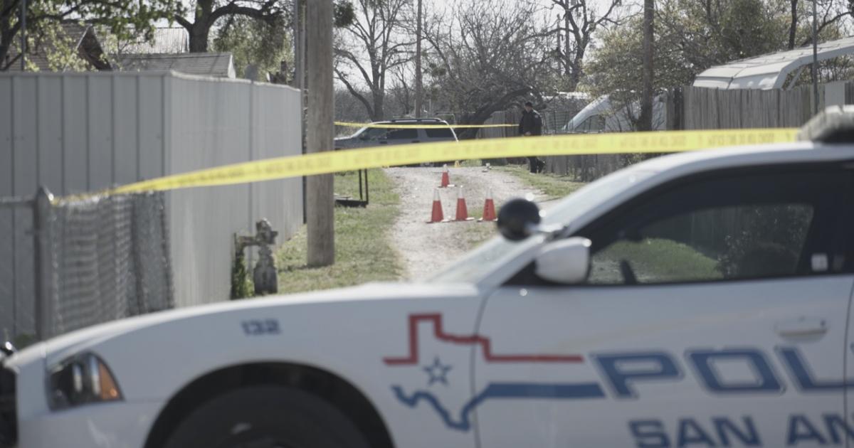 Police Surround Alleyway with Crime Scene Tape in Death Investigation